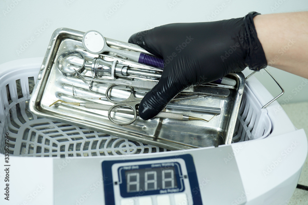 Disinfection of a dental instrument. Ultrasound sterilization of a ...