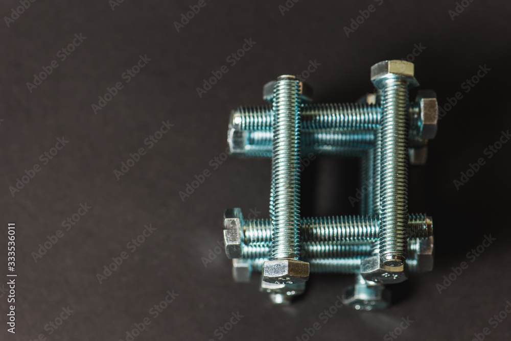 Metal bolts and nuts in a row background. Chromed screw bolts and nuts ...