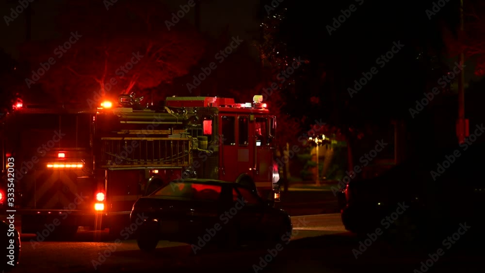 Frustrated and tired firefighter or paramedic walking next to a fire ...