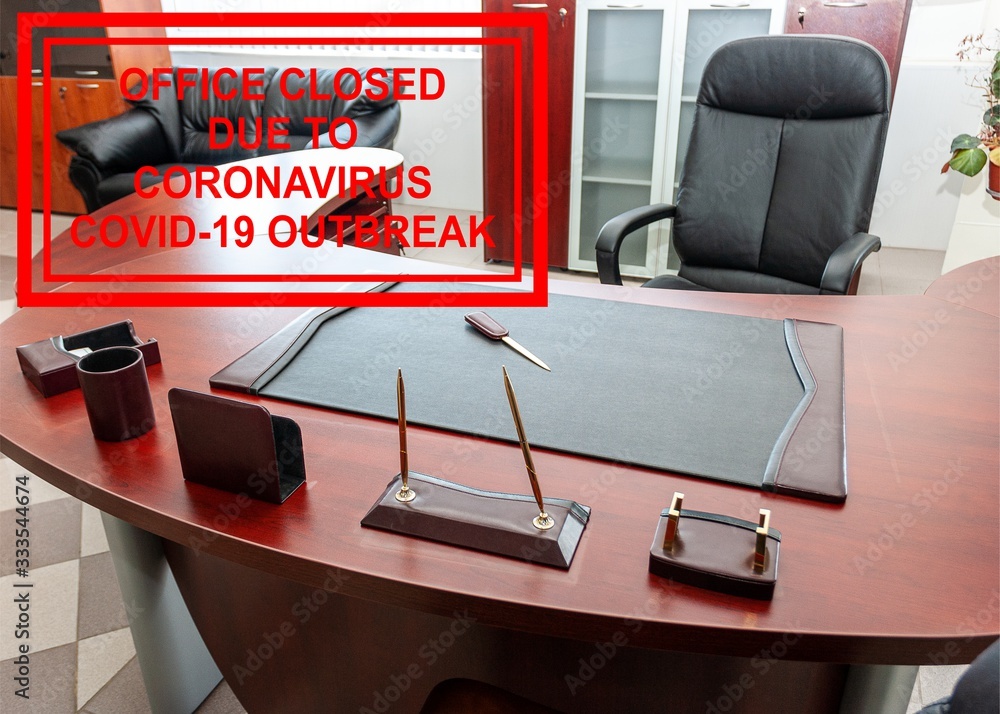 Modern office interior with a notice saying ''Office closed due to ...