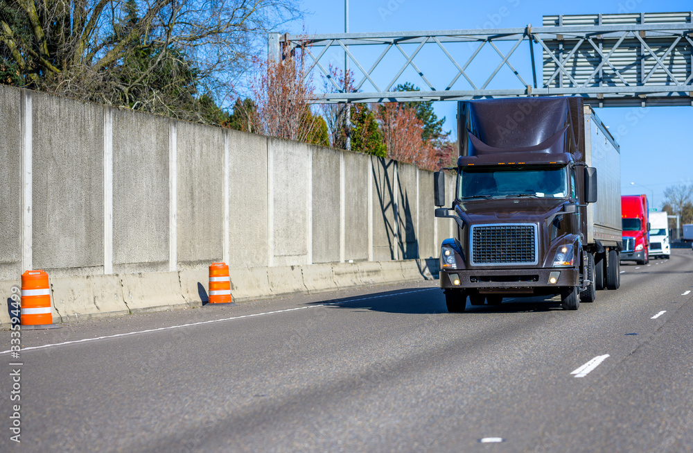 Convoy of different big rigs semi trucks with semi trailers ...