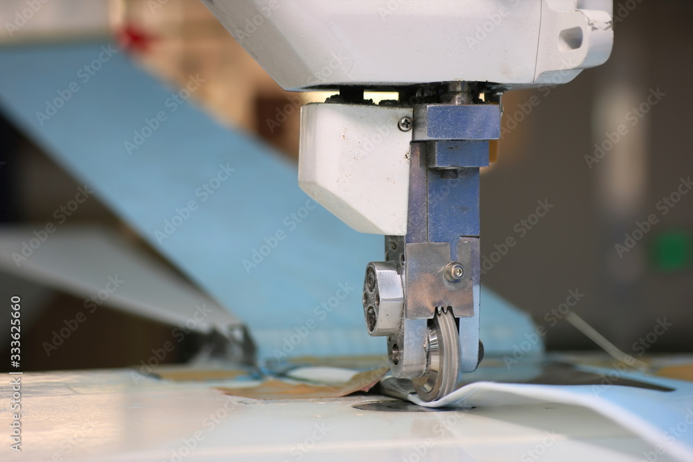 Automated production robots are making surgical masks to seal the sides ...