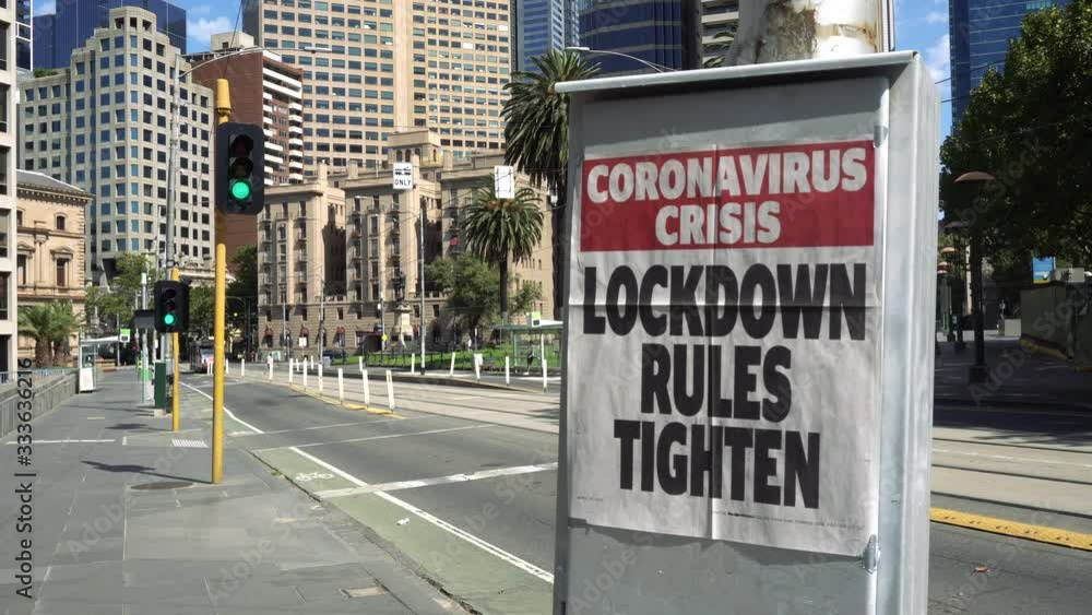 Empty streets in Melbourne, Australia alongside 'lockdown' newspaper ...