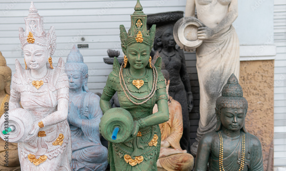 .statues of indonesian gods, hindu deities. Travel souvenirs in the ...