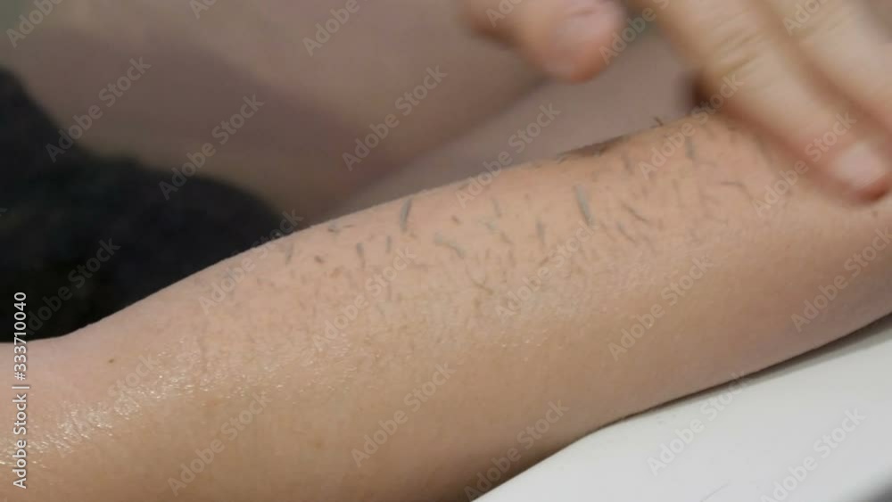 A teenager in the bathroom, wet, dirty skin of acidity and dirt sliding ...