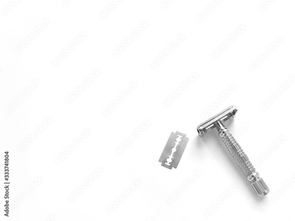 T - shaped metal razor with interchangeable blades. Butterfly safety ...