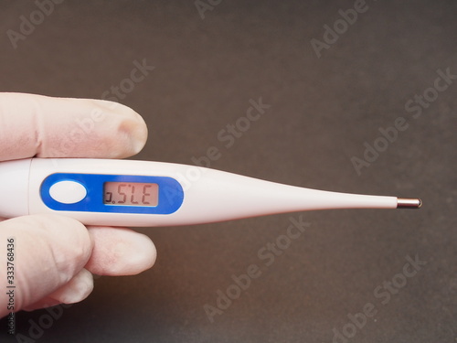 Subfebrile temperature. The display of the electronic thermometer shows ...
