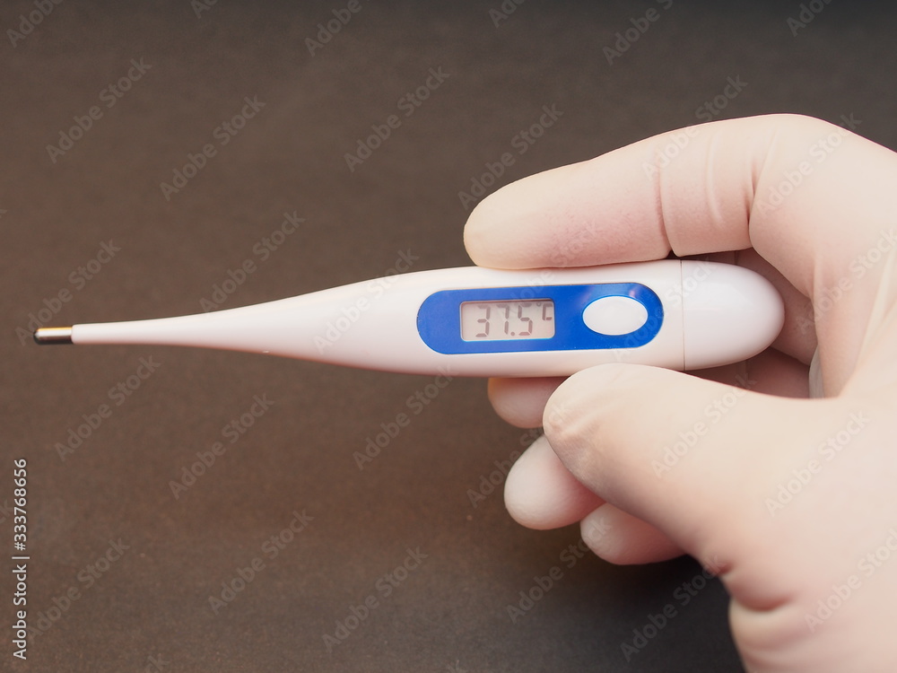 Subfebrile temperature. The display of the electronic thermometer shows ...