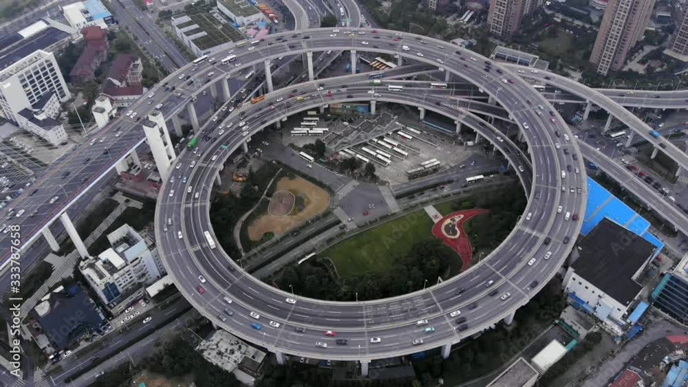 Large spiral shaped interchange at end of bridge, aerial panorama of ...