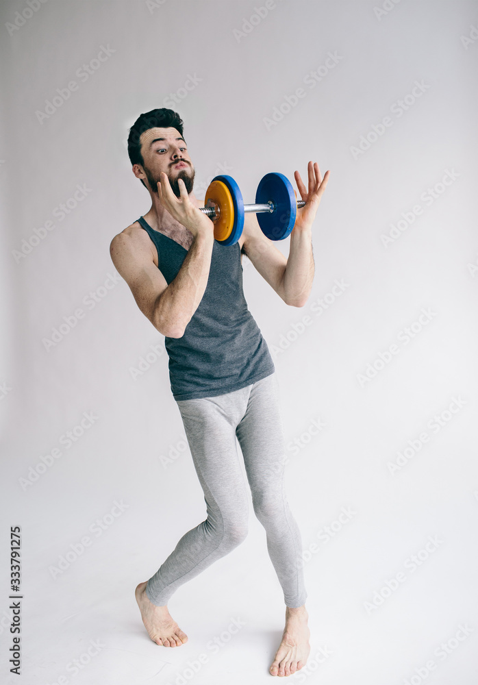 Skinny man training his bicep muscle. Guy lifting one dumbbell. young ...