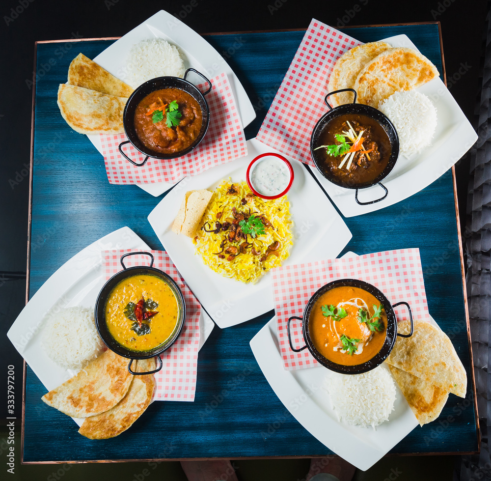 Indian meal with curry and biryani. Stock Photo | Adobe Stock