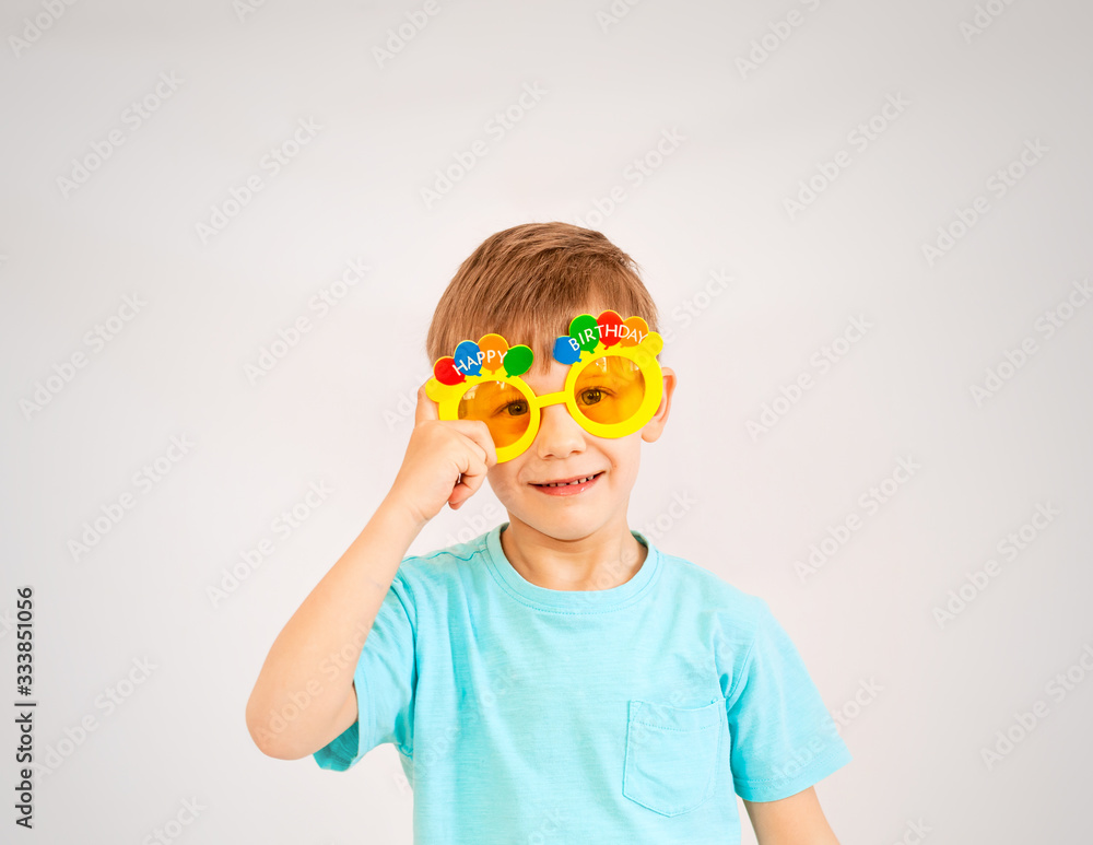 little cute boy wearing party glasses with Happy Birthday text. boy in ...