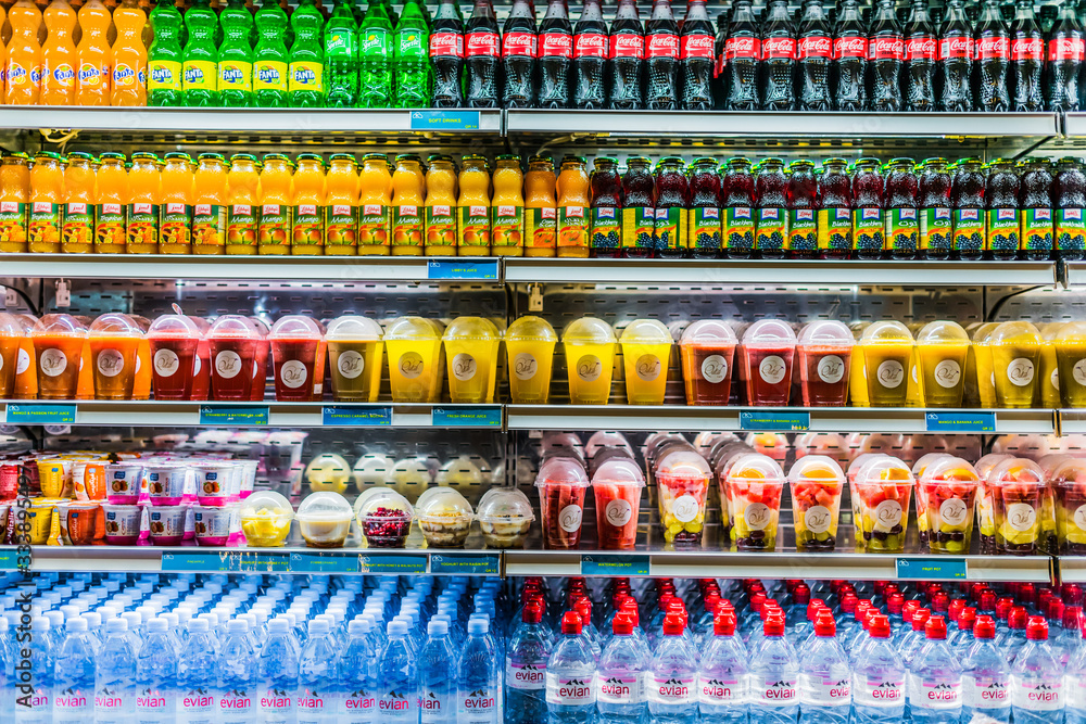 Cooled drinks and fruits displayed in a commercial refrigerator Stock ...