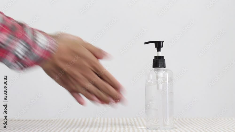 A man clean his hands sanitizing to protect and take care of his health ...