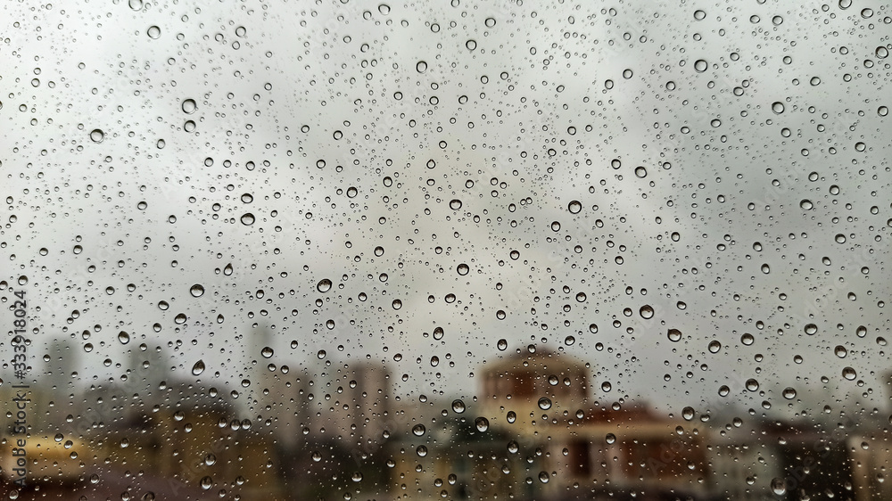 Raindrops on office window with blur grey sky background. Office window ...