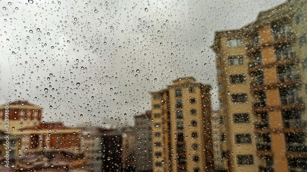 Raindrops on office window with blur grey sky background. Office window ...
