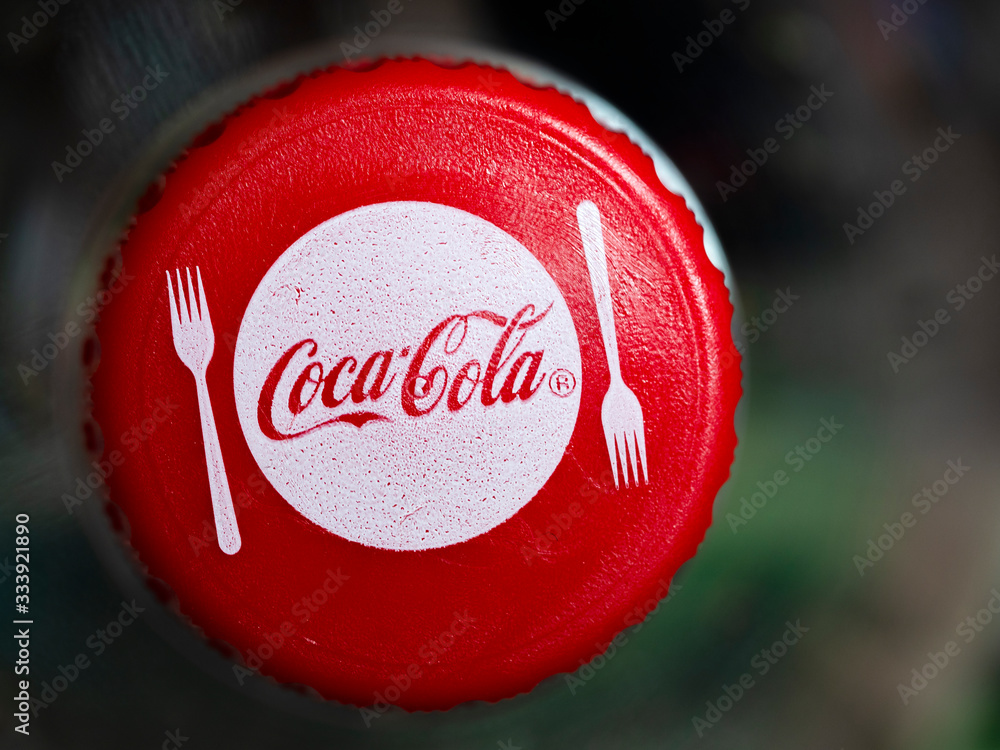 In this photoillustration Logo of Coca-Cola is seen on a bottle cap ...