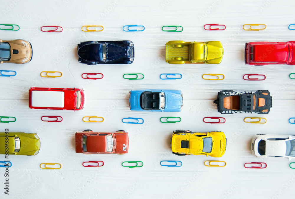Many multi-colored toy cars on white background. The group of car toy ...