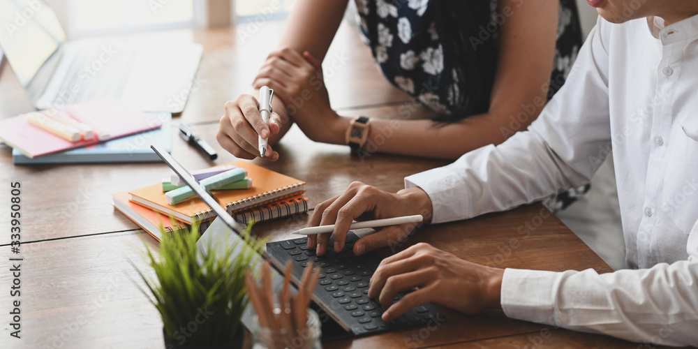 Cropped image of graphic designer team working together by using a ...