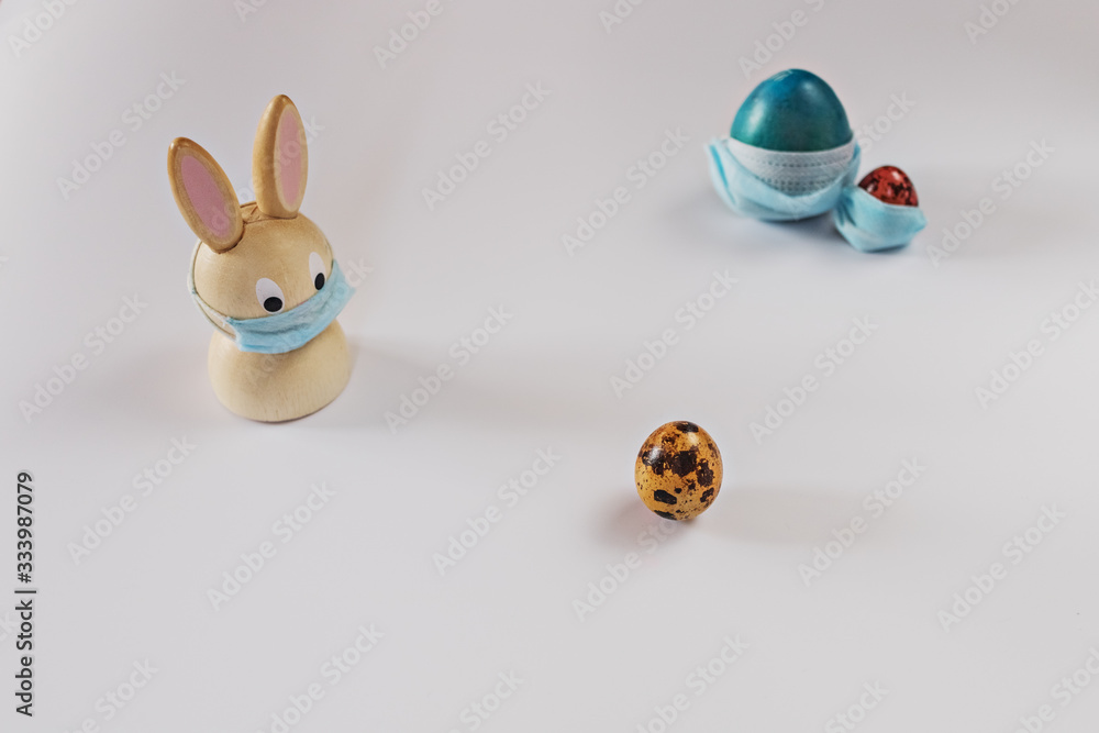Isolated painted easter eggs in medical masks. Easter during the ...