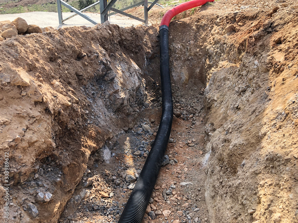 The high voltage electrical cable is laid in a trench ภาพถ่ายสต็อก ...