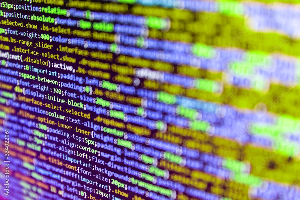 Computer code on laptop (web developing). Developer working on program ...