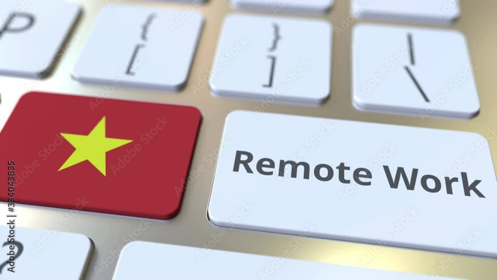 Remote Work text and flag of Vietnam on the computer keyboard ...