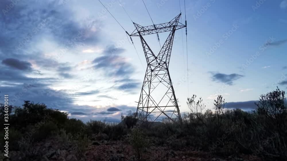 Stockvideo Electricity transporting through scenic tower of power lines ...