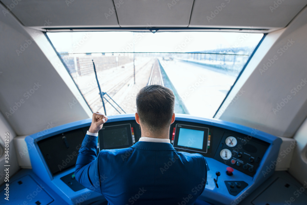 Train subway driver holding fist in the air. Successful public ...