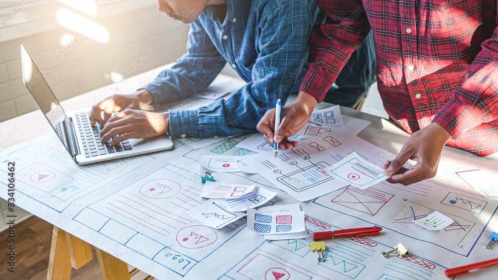 close up male asian ui/ux designers working and designing a user ...