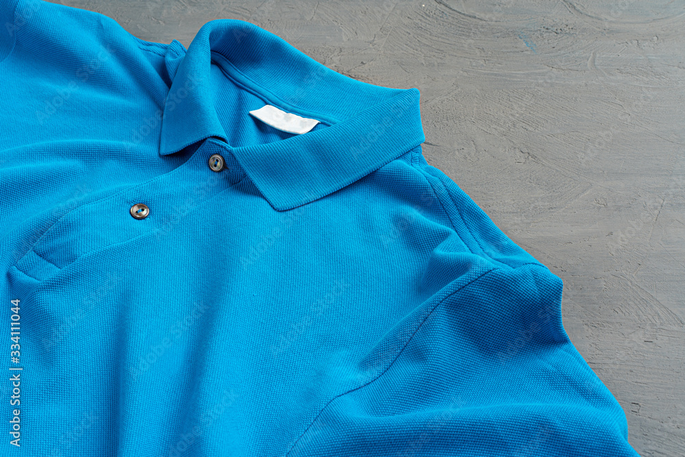Blue cotton polo t-shirt texture close up. Men's fashion Stock Photo ...