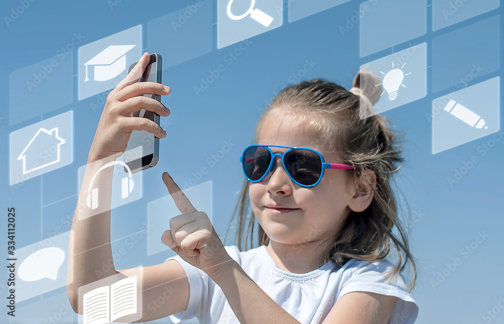 School child holding a mobile smartphone. Kid studying online. Touch ...