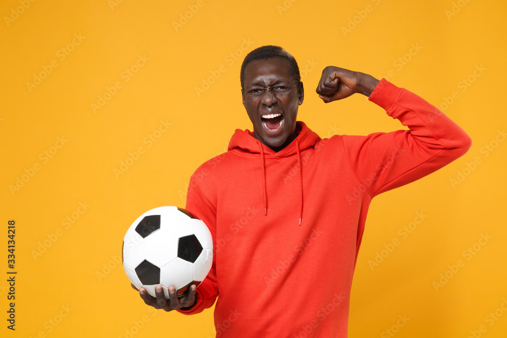Screaming young african american man guy football player in red hoodie ...