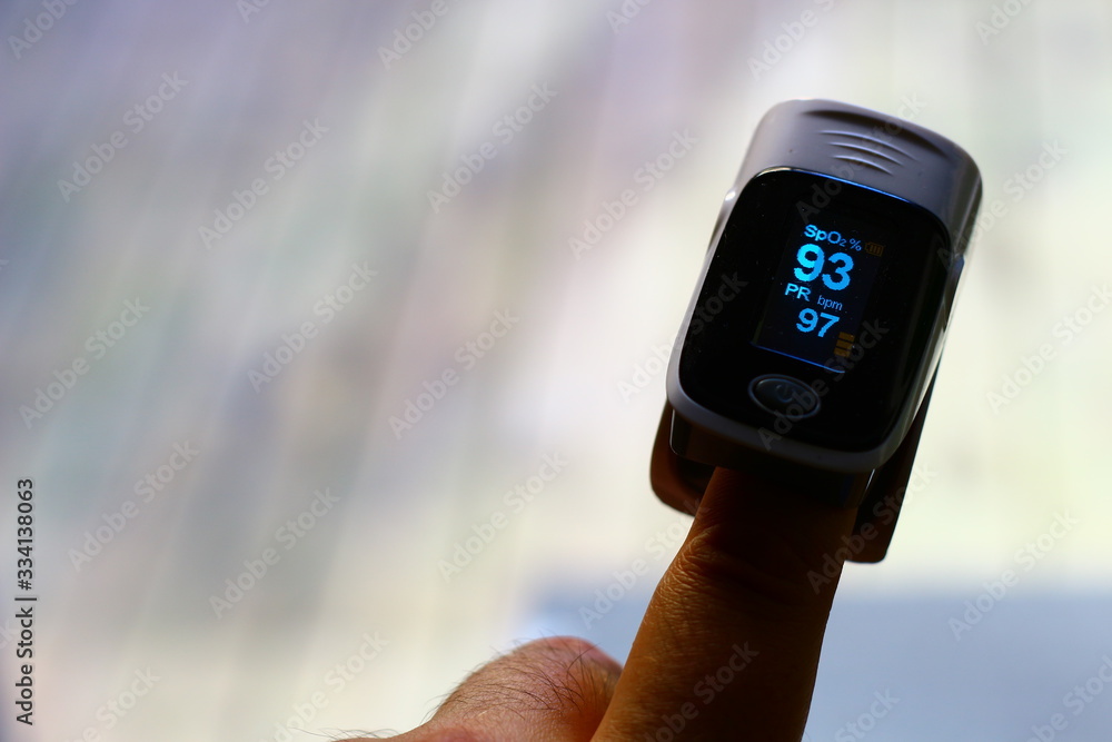 Pulse oximeter measuring oxygen saturation in blood and heart rate ...