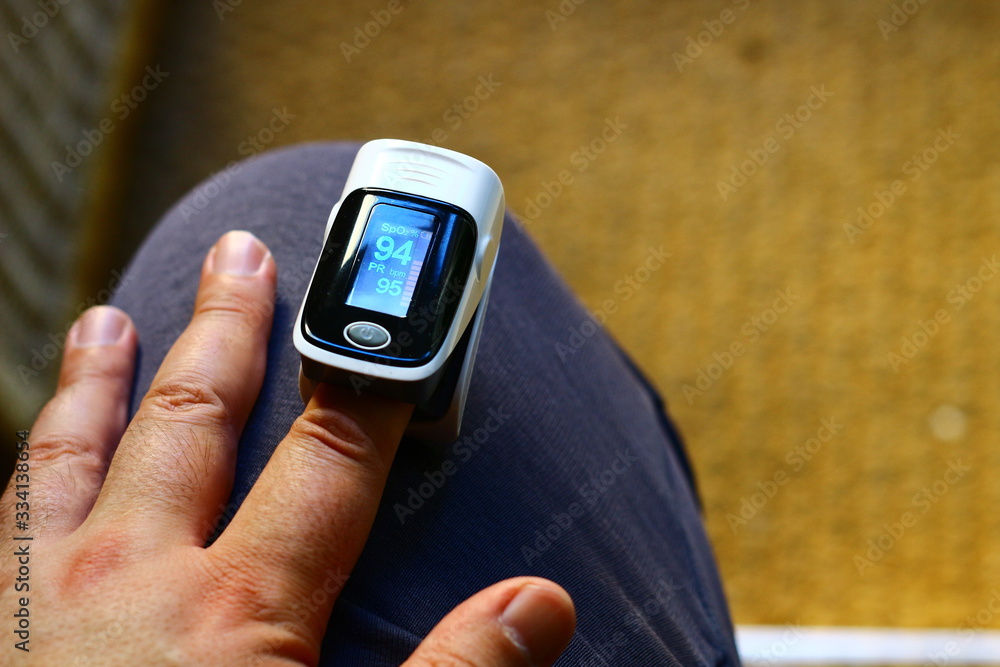 Pulse oximeter measuring oxygen saturation in blood and heart rate ...