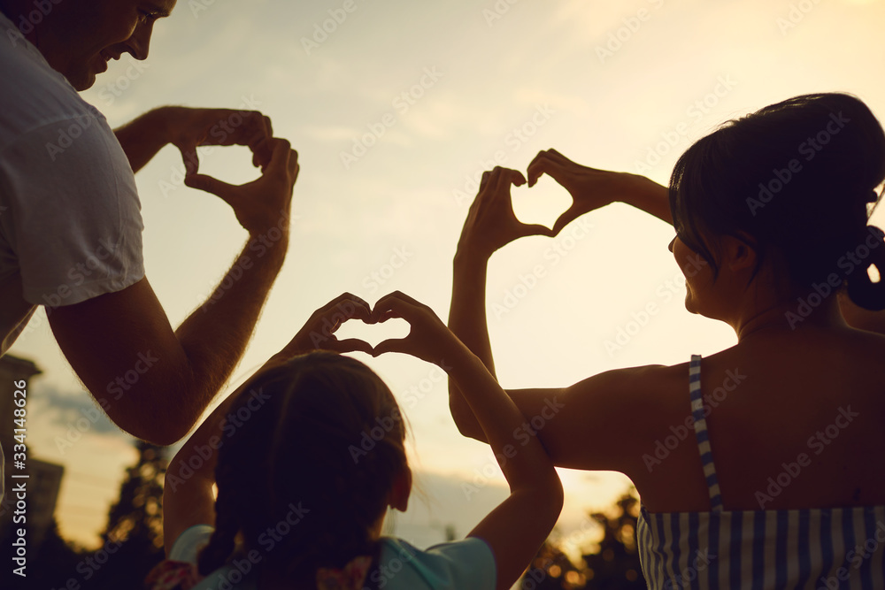Family heart symbol by kid father mother hands. Stock Photo | Adobe Stock