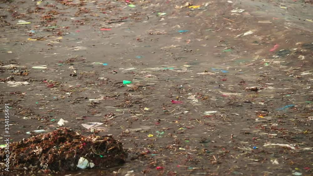 Stockvideo Slow motion. Waves of garbage on worlds most polluted beach ...