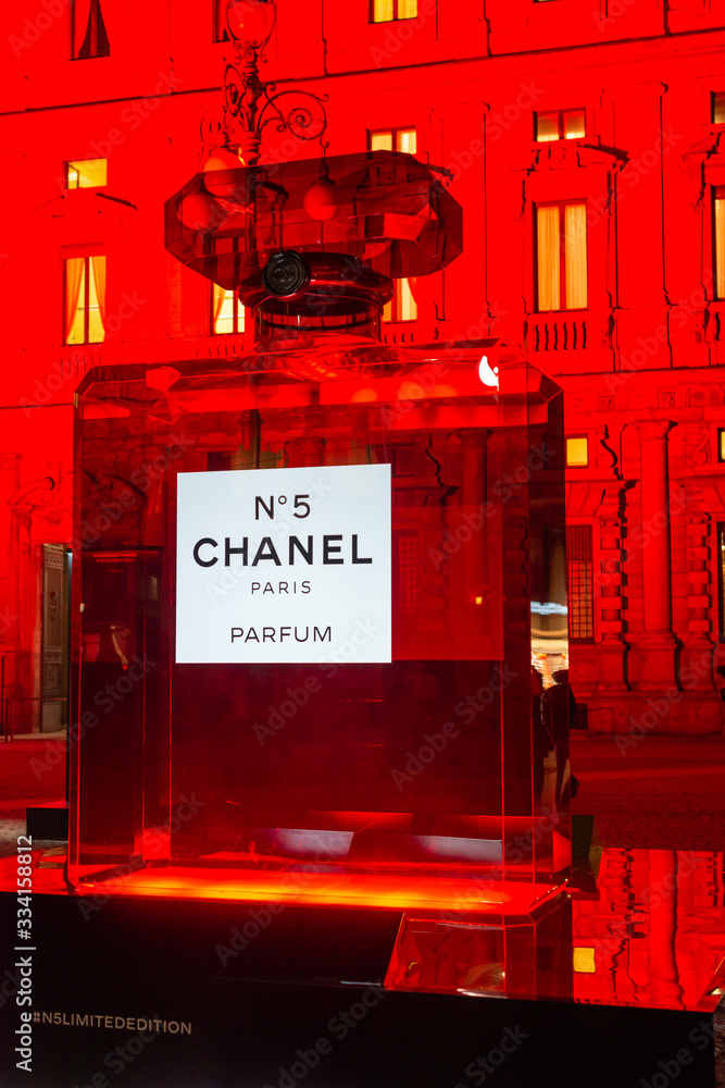 Red Limited Edition Number 5 perfume on display with red background ...