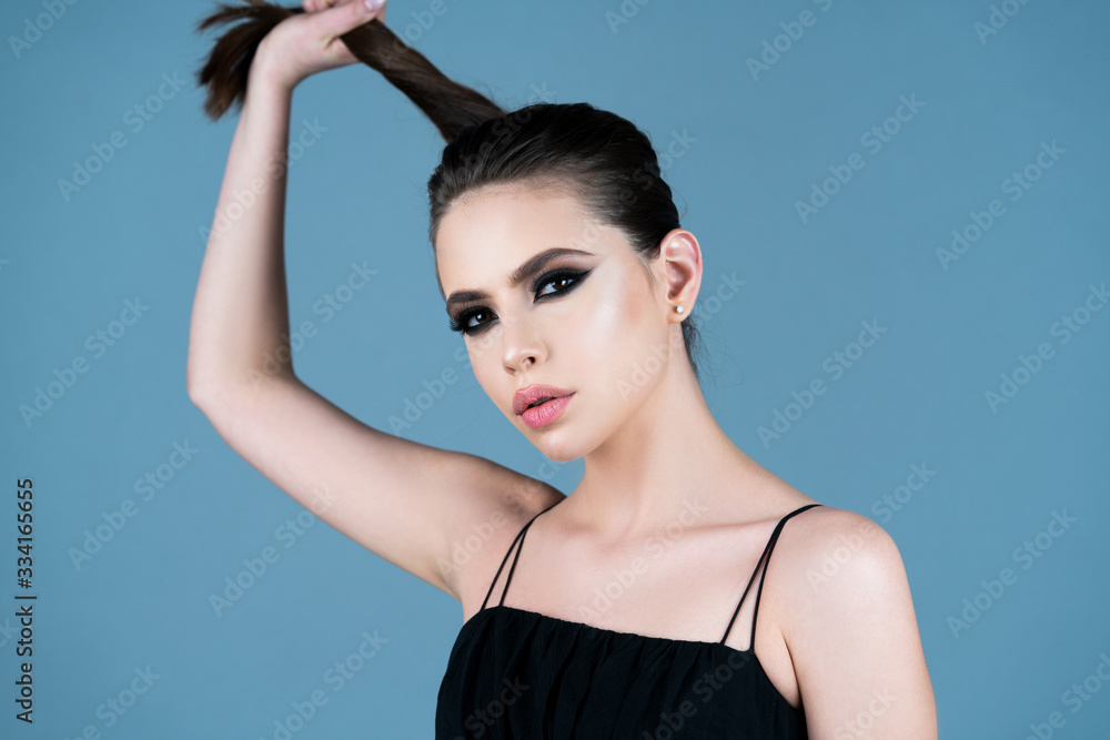 Strong hair. Beautiful model girl with shiny brown and straight long ...