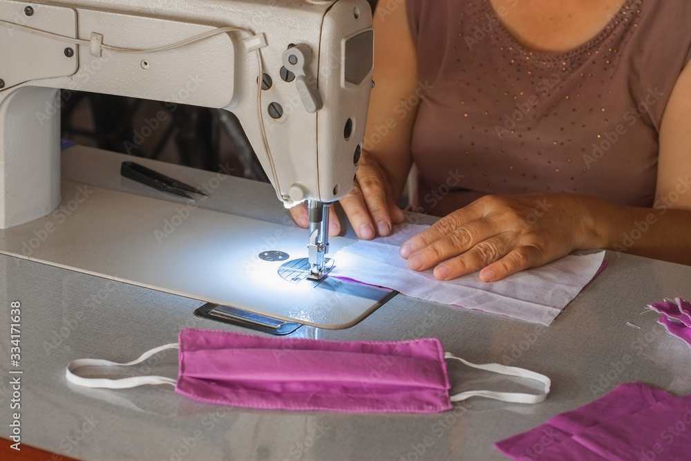 Handmade mask sewing from the fabric is used to prevent spread disease ...
