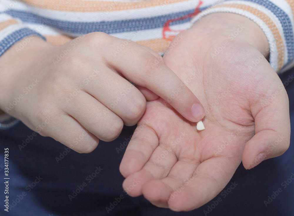 the child has lost a tooth he does not know whether to be happy or sad ...