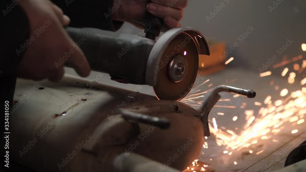 Metal cutting grinder. Sparks from metal cutting. Car tuning. Car ...