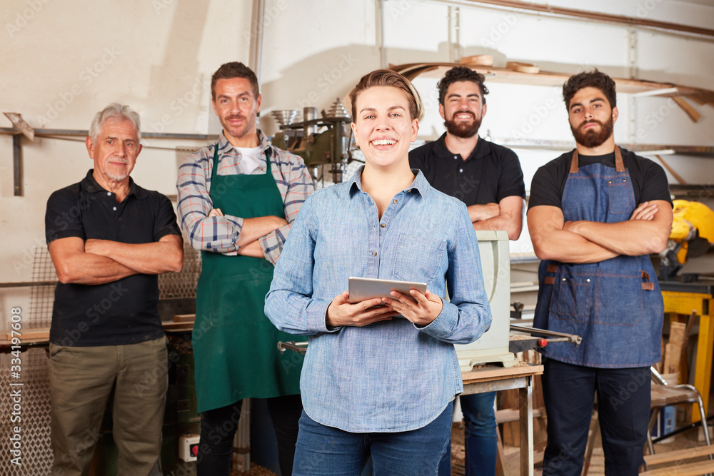 Woman as an apprentice with tablet computer Stock Photo | Adobe Stock
