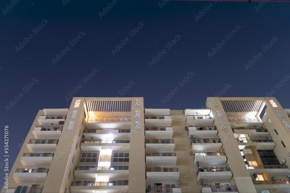 Timelapse shot looking up at a skyscraper multistory building with ...
