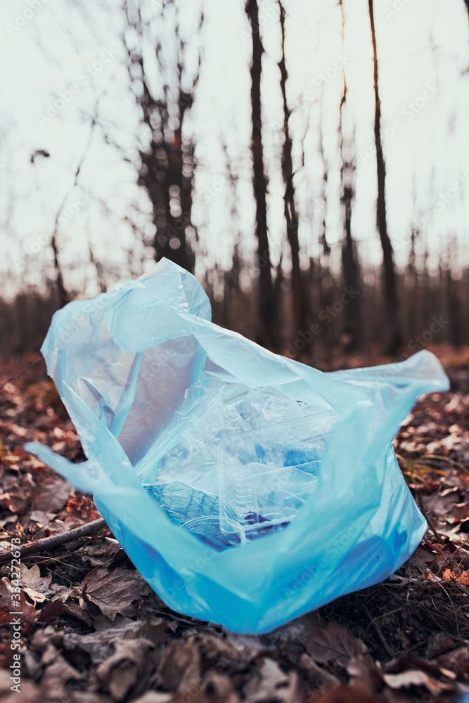 Plastic waste left in forest. Concept of plastic pollution and ...