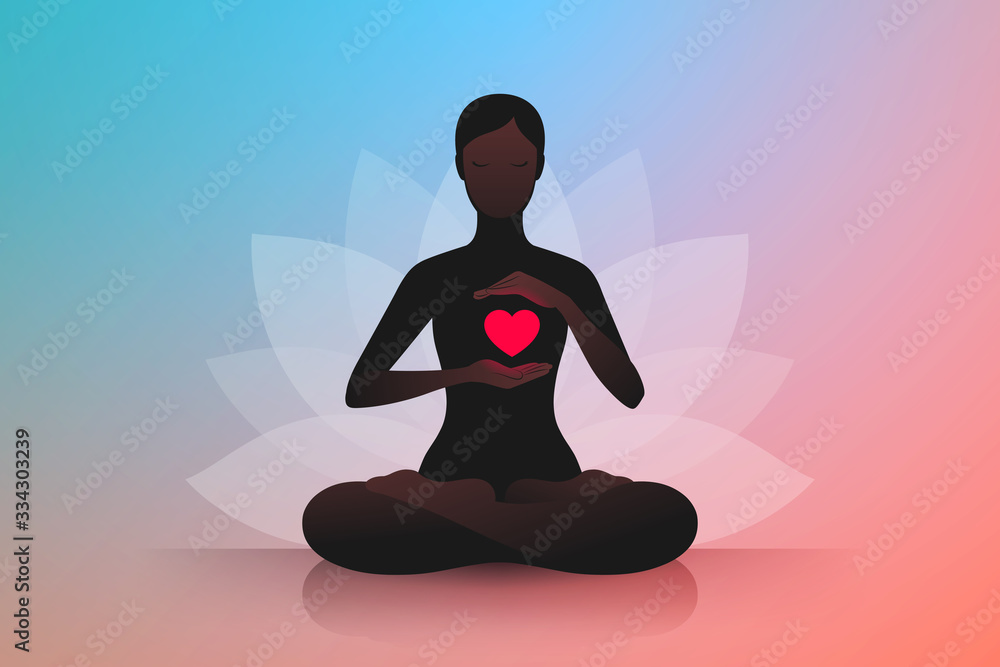 Woman sitting in lotus position and holding hands near her red heart ...
