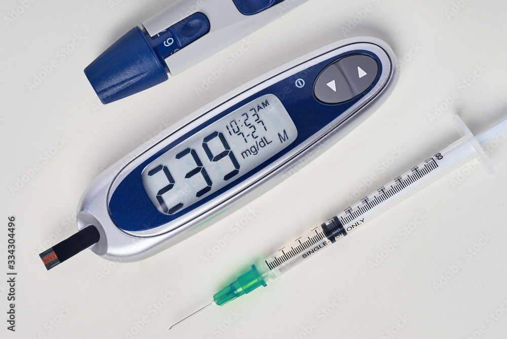 diabetes, glucometer with glucose measurement on screen and blood on ...