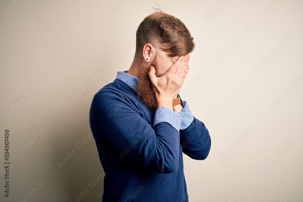 Handsome Irish redhead business man with beard standing over isolated ...