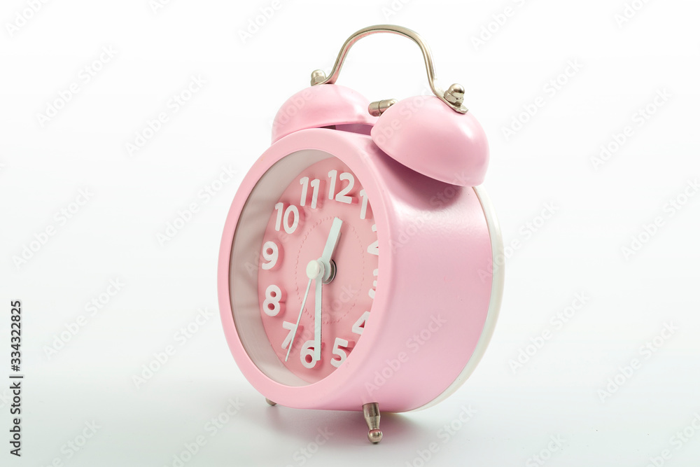 Sleep hygiene, wake up ring and old fashioned clocks concept with pink ...