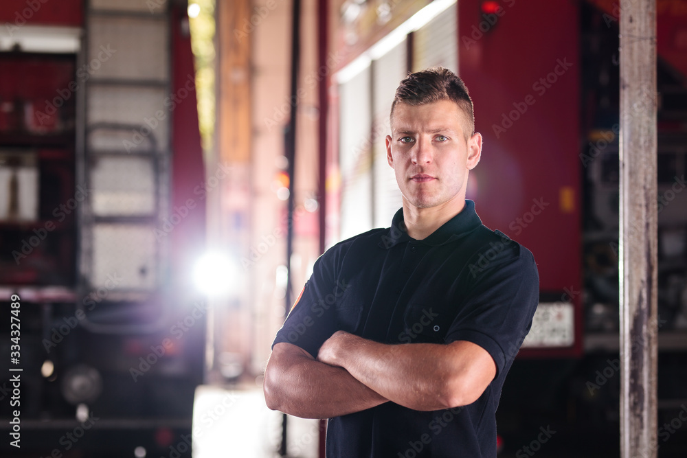 Professional fireman portrait. Firefighter wearing shirt uniform and ...
